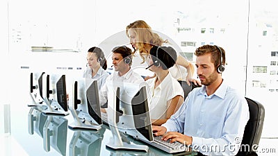 Supervisor Checking on Call Centre Employees Stock Video - Video of ...