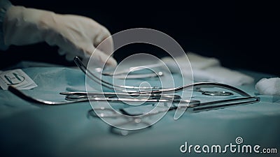 Table with Surgical Instruments in Dark Sterile Operating Room Side ...