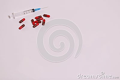 Tablets And A Syringe On A White Background. A Syringe For Injection ...