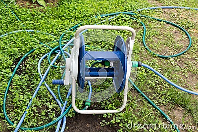 Tangled Garden Hose With A Reel On Grass Royalty-Free Stock Photo ...