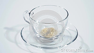 Tea Leaves are Falling in Glass Transparent Cup. Slow Motion Stock ...