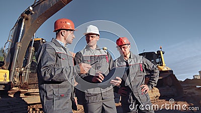 Team of Professional Male Engineering Worker in Uniform Discussing ...
