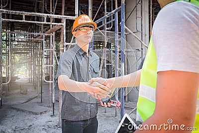 Teamwork, Partnership, Gesture Concept. Builders Greeting Each Other With Handshake On ...
