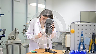 Technician Holding Prosthetic Leg Checking and Working in Laboratory ...
