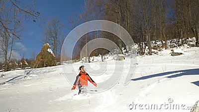 Teen Walking in Deep Snow and Falling into it at the Mountain Stock ...