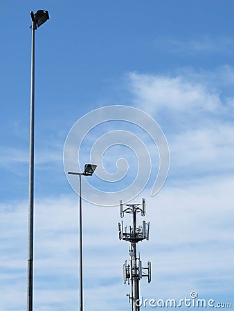 Telecommunications Cell Phone Tower And Light Poles Stock Photo - Image ...