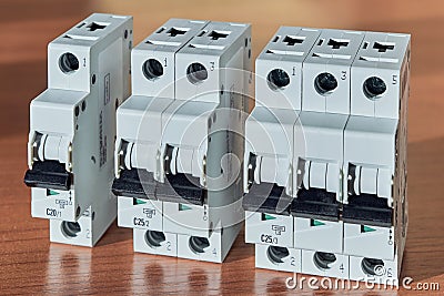 Three Modular Electrical Circuit Breakers Lie On The Table. Stock Image ...