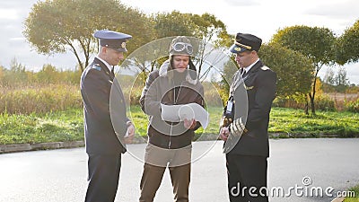 Three Pilots Briefing A Flight Plan Documents Uniform Weather Stock ...