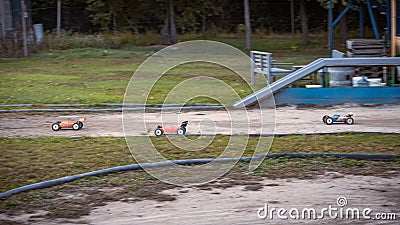 Three RC Buggies Racing On An Outdoor Offroad Track Stock Photography ...