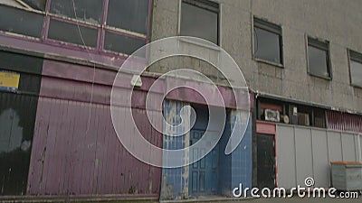Tilt Down the Exterior of a Run Down Building Stock Footage - Video of ...