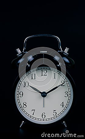 Time Is Up - Alarm Clock Standing Isolated On Black Background. Royalty ...