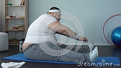 Tired Overweight Man Stretching and Falling Down Mat after Exhausting ...