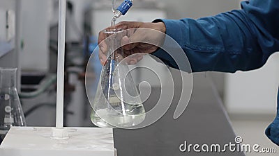 Titration Reaction By Shaking Colorless Liquid In Conical Flask Under A ...