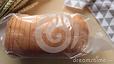 Top View of Baked Bread in a Plastic Packet on Black Background Stock ...