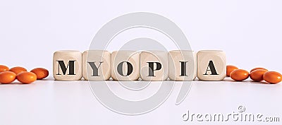 Top View Blocks With Word MYOPIA On White Background With Pills Royalty ...