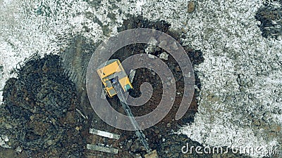 Excavator Digging Soil at a Construction Site. Top View of an ...