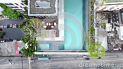 Top View of an Infinity Pool at the Hotel Rooftop with Man Sitting on ...