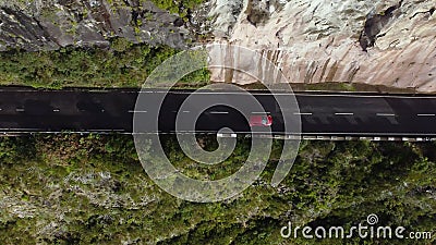 Top View of a Single Car Driving on a Highway between Rocks and ...