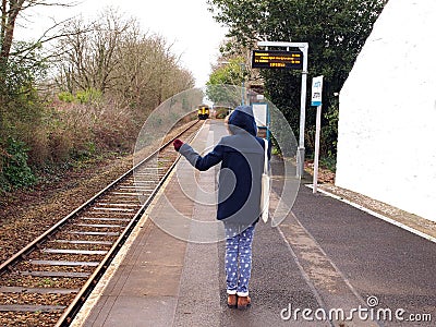 Train Request Stop - Girl Signalling To Driver To Stop Train Stock ...