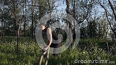 Training on Crossfit on Open Ground, Park. the Sportsman Throws the ...