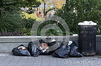 Trash Can Full Of Garbage In Front Of Stanley Park In Downtown ...