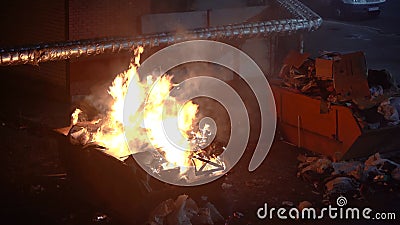 Trash cans burn at night stock footage. Video of firework - 240198372