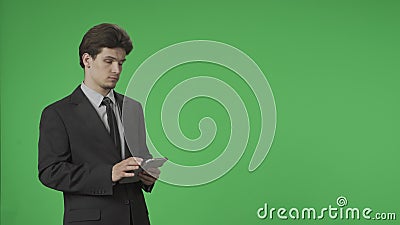 TV Presenter in the Studio Against the Background of a Green Screen. a ...