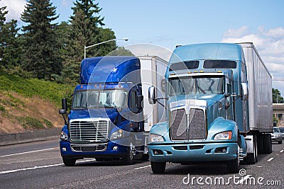 Two Big Rigs Semi Trucks In Blue Tone And Different Models With Stock ...