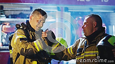 Two Firefighters Shaking Hands after Successfully Extinguished Fire ...