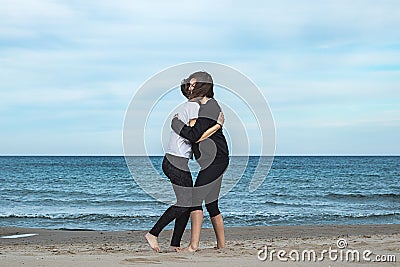 Two Girls Hugging On The Beach Stock Photo | CartoonDealer.com #114222576