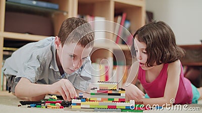 Two Kids Playing with Lego Bricks at Home Stock Video - Video of girl ...