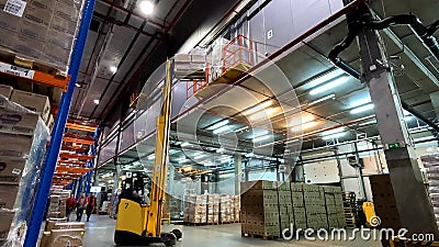 Two Level Warehouse. the Forklift Picks Up a Pallet from the Second ...