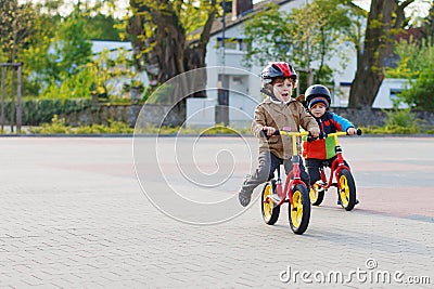 Two Little Siblings Having Fun On Bikes In City On Vacations Stock ...
