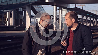 Two Men On The Platform Of The Railway Station Waiting For The Arrival ...