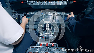 Two Men are Sitting in a Cockpit of a Flight Simulator and are ...