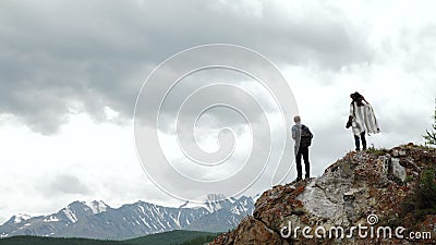 Two People Standing on Top of a Mountain Stock Video - Video of ...