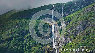 Two-tier Waterfall on the Forest-covered Cliffs Above the Loenvatnet ...