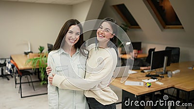 Two Women Hugging and Smiling at Each Other in Office Stock Footage ...
