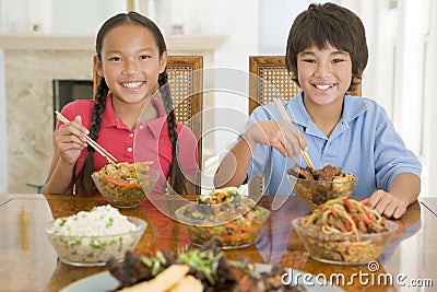 Two Young Children Eating Chinese Food In Dining R Royalty-Free Stock ...