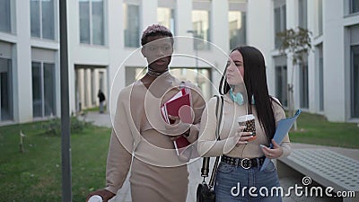 Two Young College Students Walking Around the University Campus Stock ...