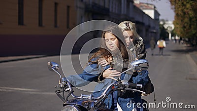 Two Young Women in Love Sit on Motorcycle, Hugging Stock Footage ...
