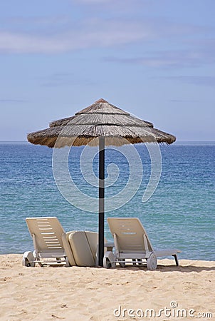 Bast Parasol And Plastic Sun Lounger On The Sandy Beach Royalty-Free ...