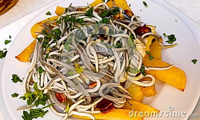 Typical Spanish Food: Gulas With Garlic, Parsley And Chips Royalty-Free ...