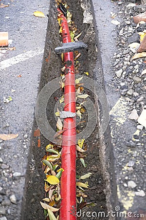 Underground Electrical Red Cable Duct In Trench At Construction ...