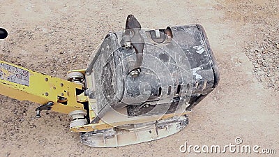 Vibrating Machine is Compacting Soil at the Construction Site. Stock ...