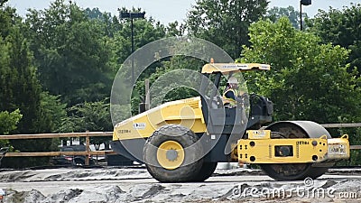 A Vibratory Roller Packer Prepares Ramp Stock Footage - Video of ...