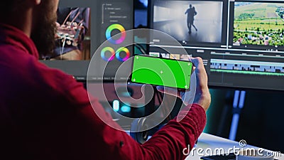 Video Editor Watching Tutorial on Mockup Phone about Editing Color ...