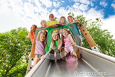 View From Below Of Many Kids On Playground Chute Royalty-Free Stock ...