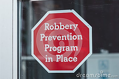 View Of Sign On The Window Robbery Prevention Program In Place In ...