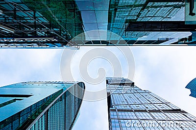 View Of The Sky From Bottom Up Between Modern Glass Skyscrapers Of ...